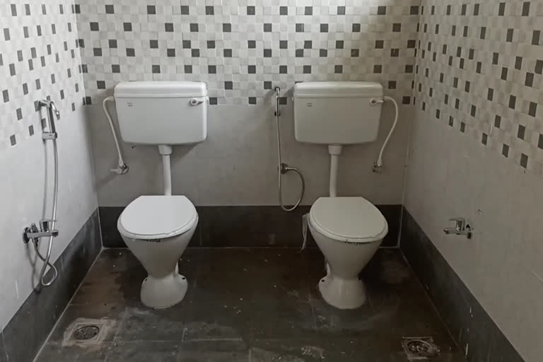 Image of 2 commodes inside one bathroom at a building inaugurated by CM ...